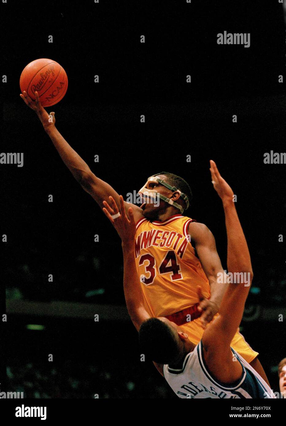 Minnesota's Willie Burton (34) bowls over Duke's Phil Henderson in the ...