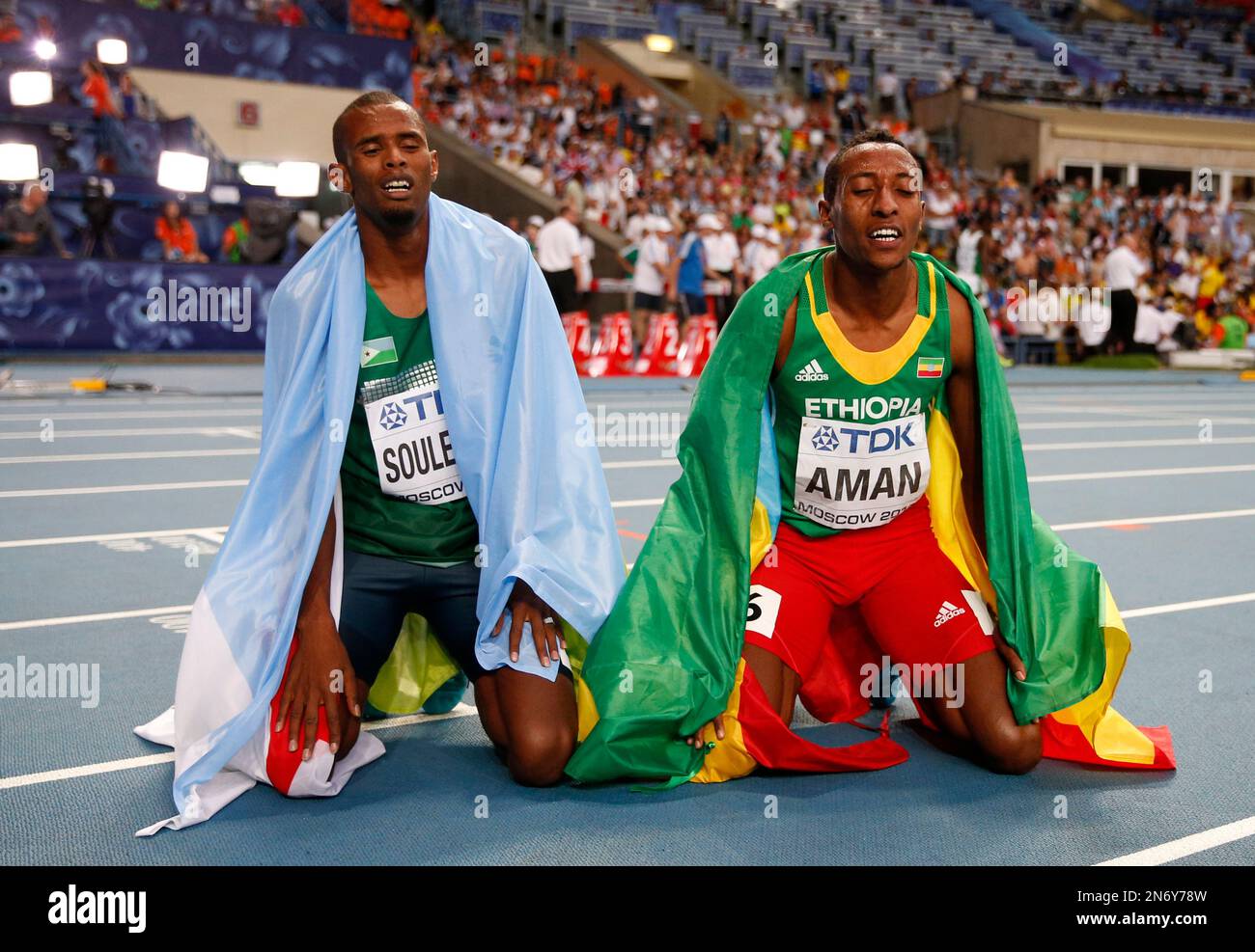 Gold medal winner Mohammed Aman of Ethiopia, right, and bronze medal ...