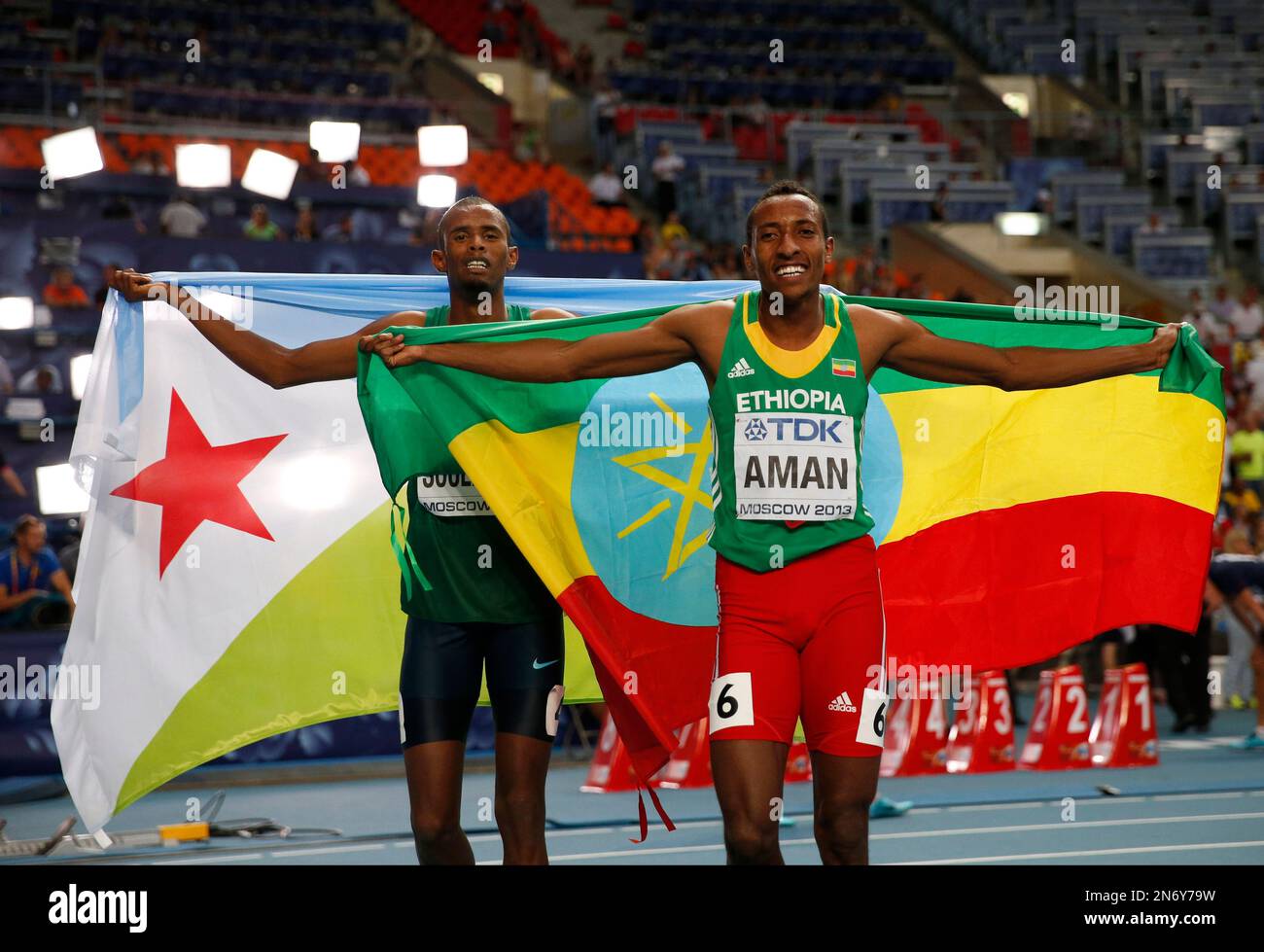 Gold medal winner Mohammed Aman of Ethiopia, right, and bronze medal ...