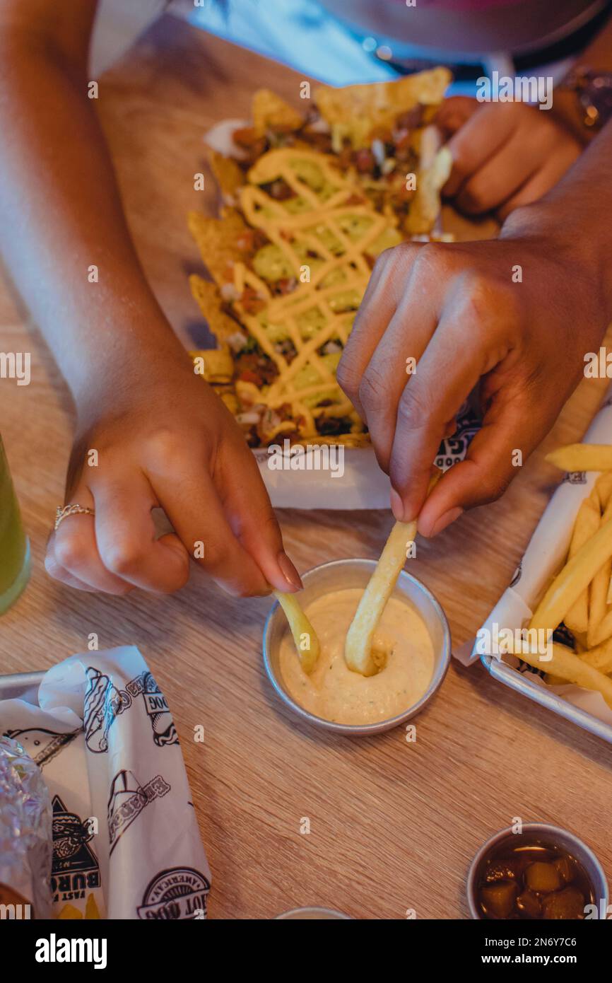 delicious fast food to share with family and friends Stock Photo - Alamy