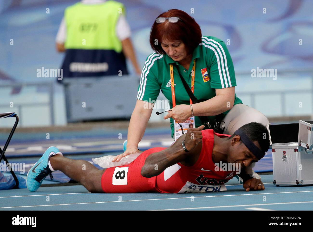 A medic tends to United States' Bershawn Jackson's leg injury during ...