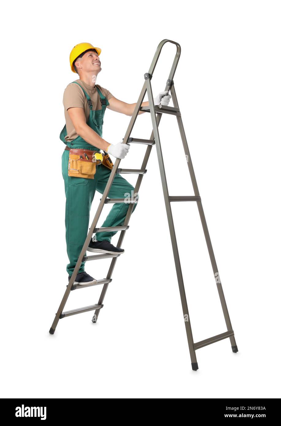 Professional constructor climbing ladder on white background Stock Photo - Alamy