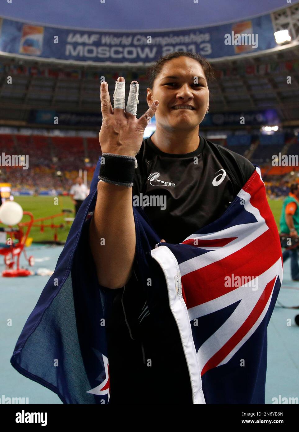 New Zealand's Valerie Adams holds up four fingers for photographers ...