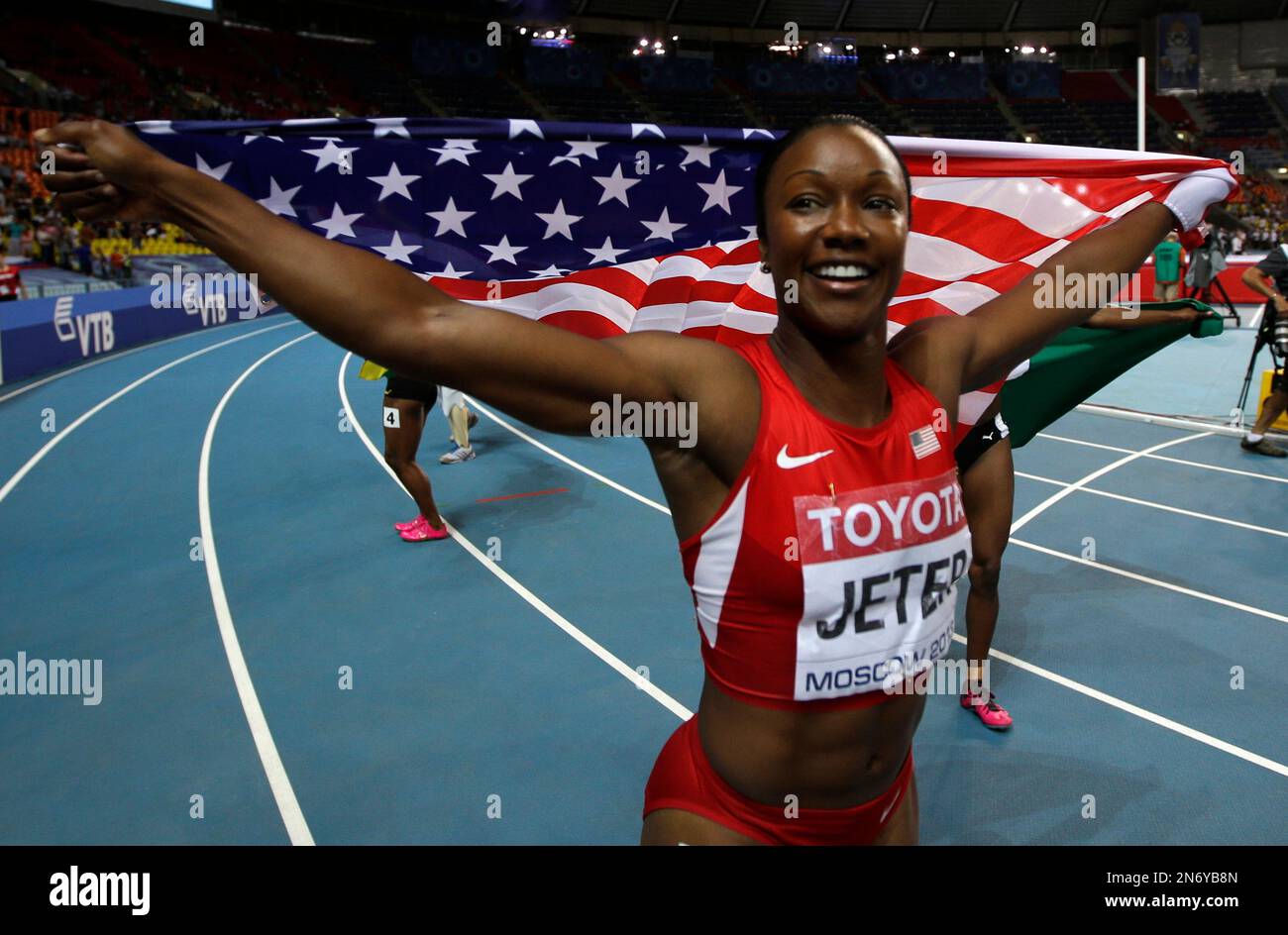 United States' Carmelita Jeter poses for photographers after her bronze ...