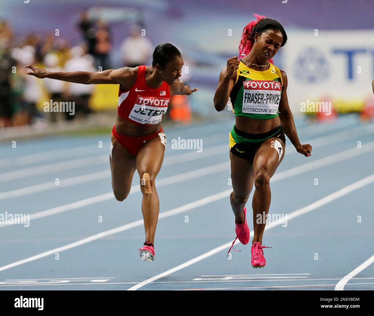 Jamaica's Shelly-Ann Fraser-Pryce, right, crosses the finish line to ...