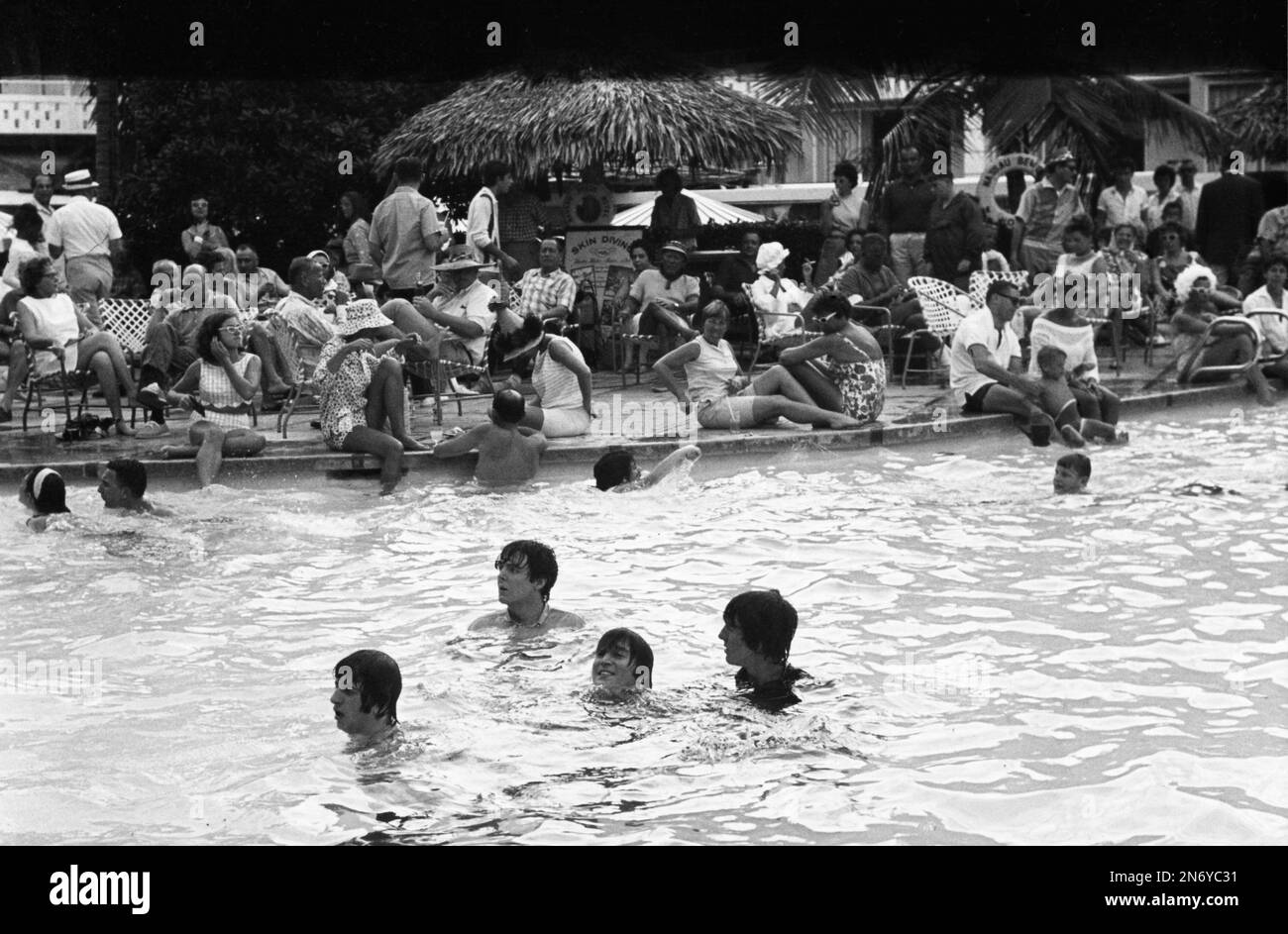 The Beatles take a dip in the pool in Nassau, Bahamas on Feb. 23, 1965 ...