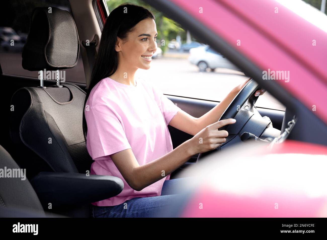 Young woman sitting in car. Driving school Stock Photo - Alamy