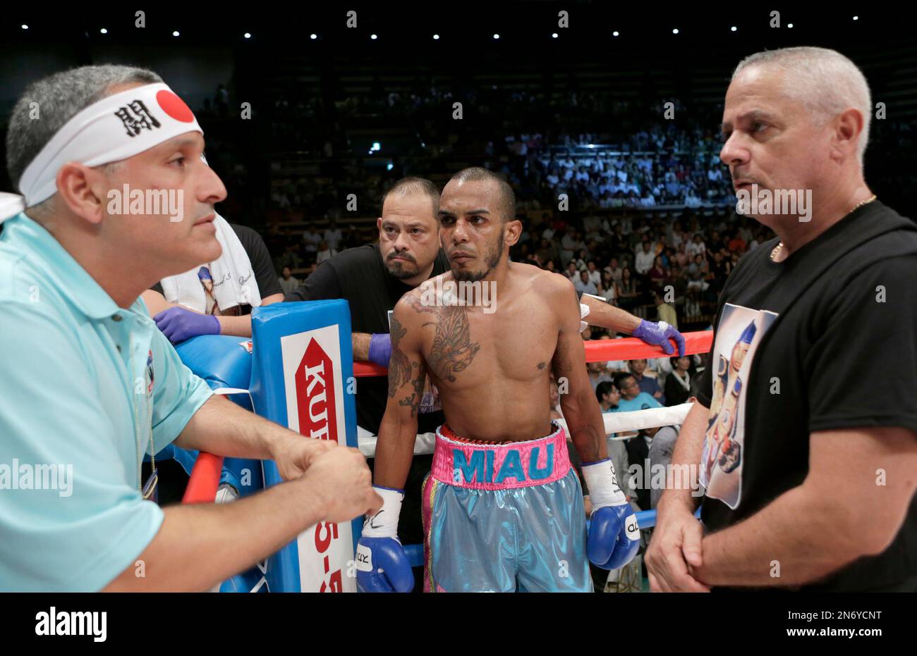 Jose Nieves, center, of Puerto Rico and his seconds, right, react after ...