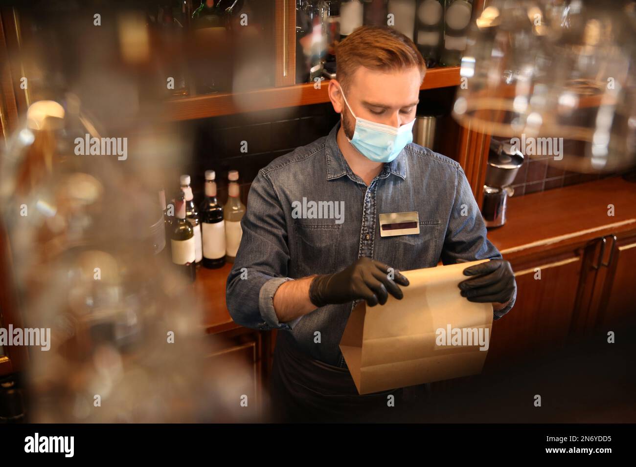Waiter packing takeout order hi-res stock photography and images - Alamy