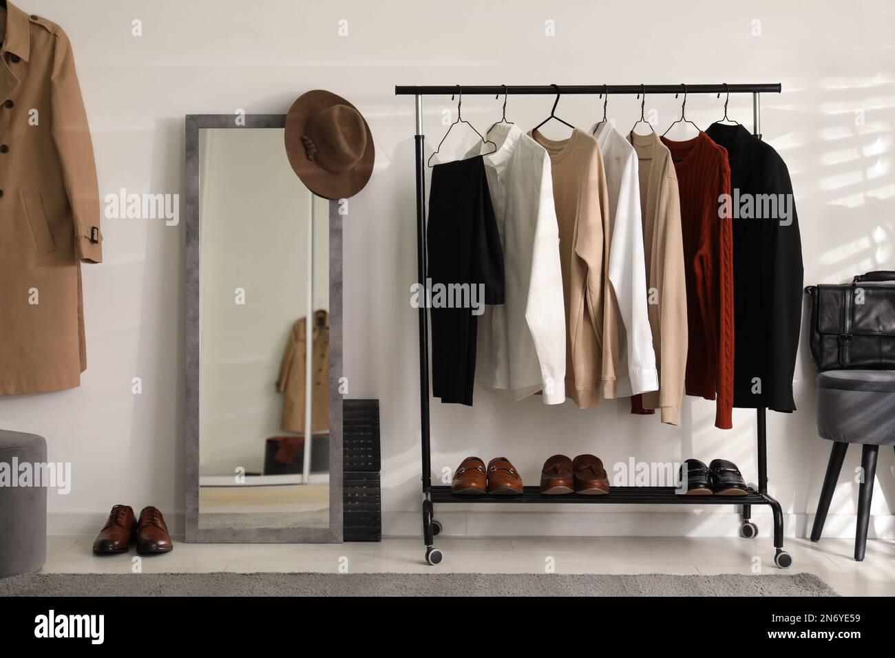 Dressing room interior with clothing rack and mirror Stock Photo - Alamy