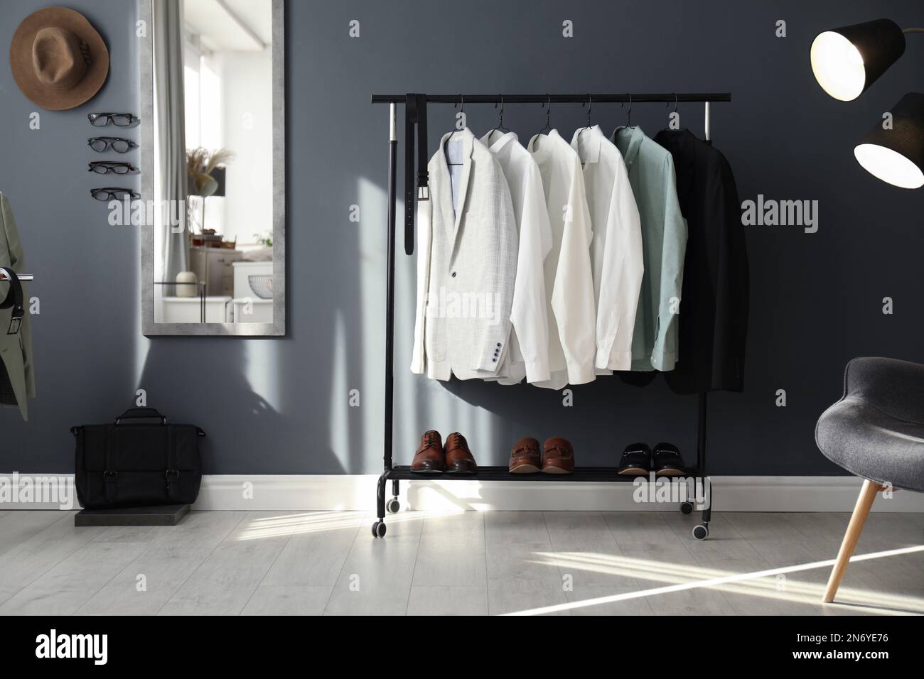 Dressing room interior with clothing rack and mirror Stock Photo - Alamy