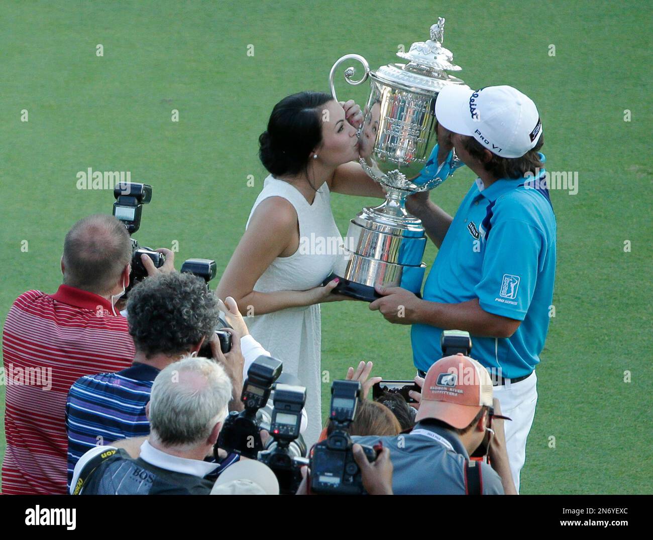 Jason Dufner, right, kisses the Wanamaker Trophy with his wife Amanda ...