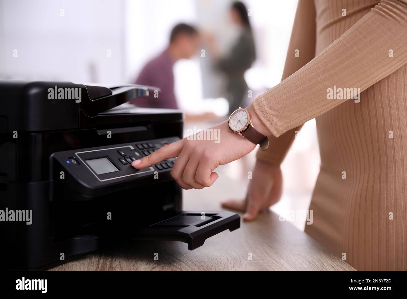 Employee using modern printer in office, closeup Stock Photo - Alamy