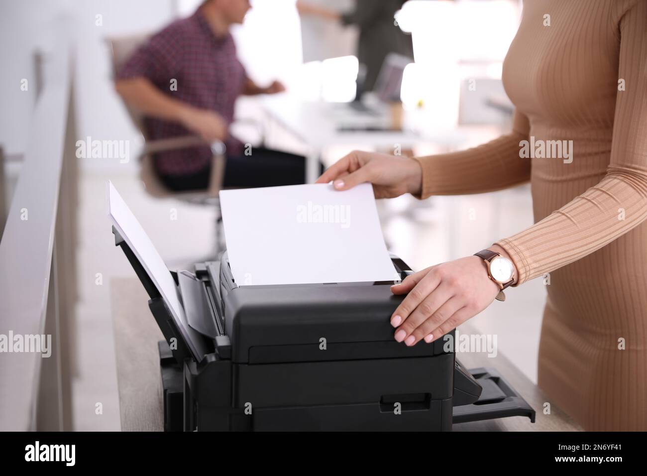 Employee using modern printer in office, closeup Stock Photo - Alamy