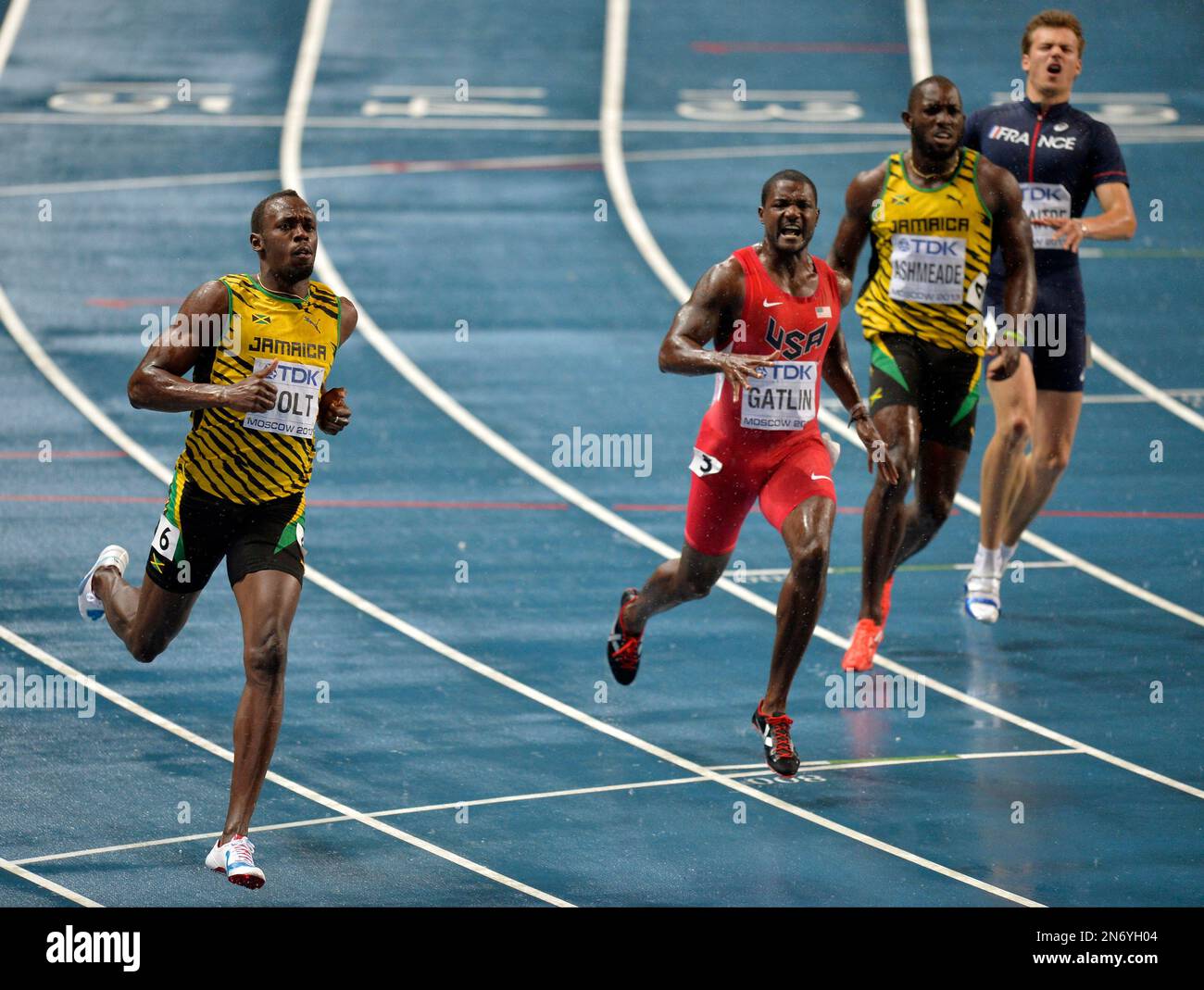 Jamaica's Usain Bolt, left, reacts after winning gold ahead of USA's Justin Gatlin, second from ...