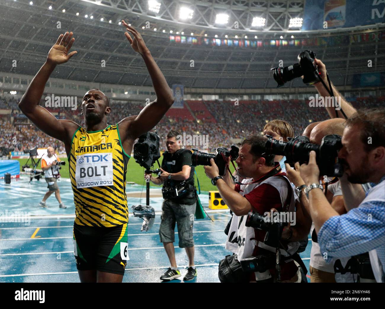 Jamaica's Usain Bolt, left, celebrates winning gold in the Men's 100 ...