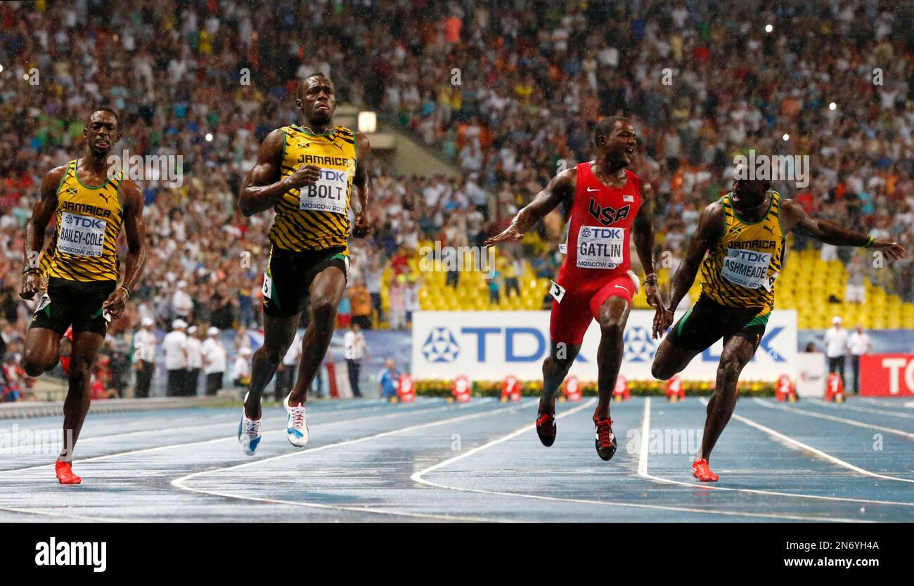 Jamaica's Usain Bolt, second from left, crosses the finish line to win gold ahead of USA's ...