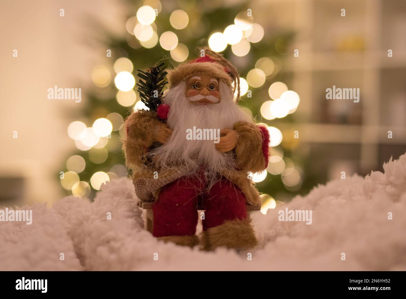 Santa Claus figure sitting on a chair Stock Photo - Alamy