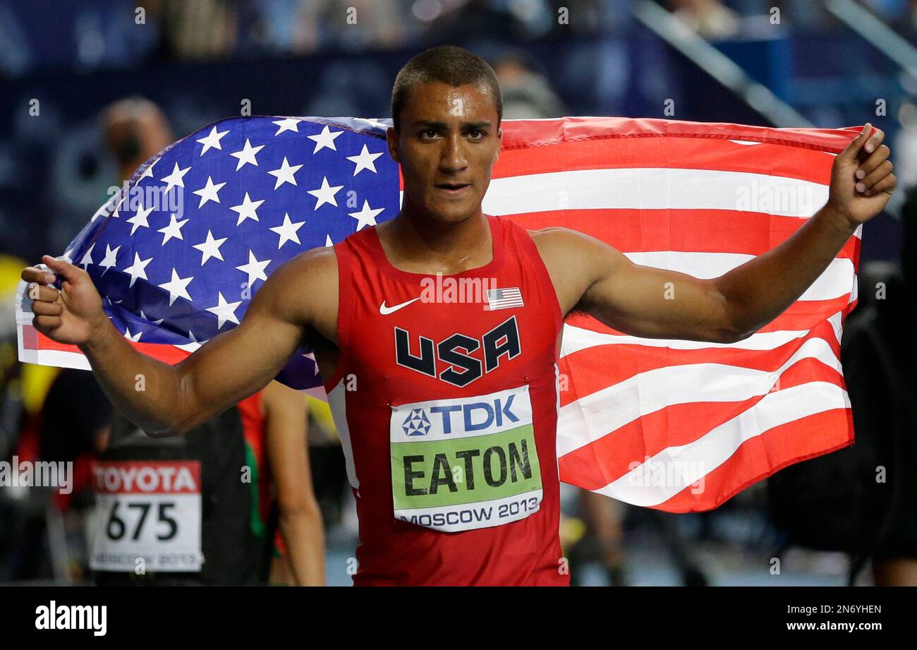 United States' Ashton Eaton is draped in the national flag after his ...