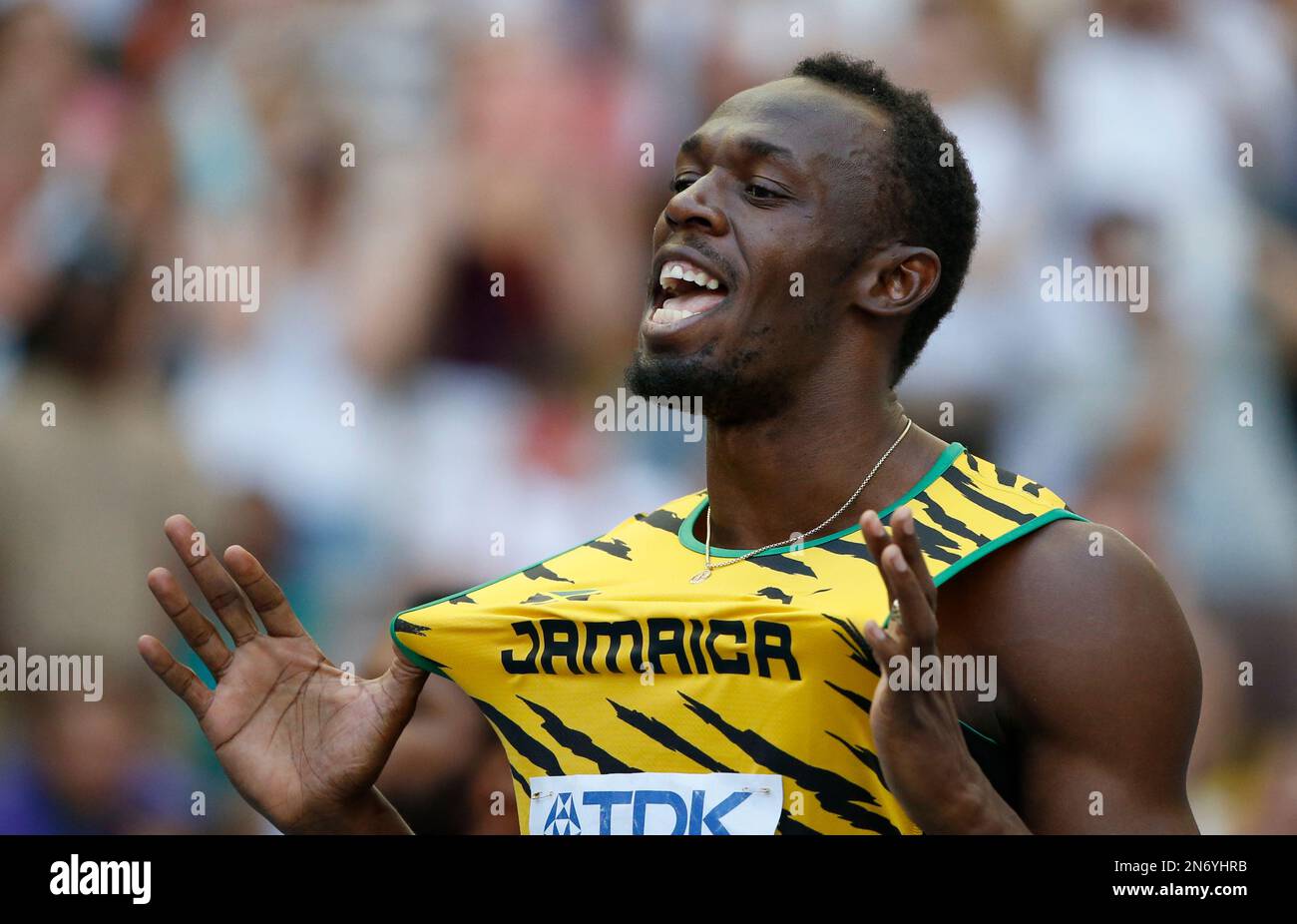 Jamaica's Usain Bolt displays his jersey before the men's 100-meter ...