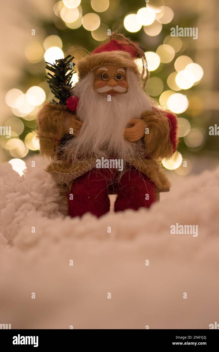 Santa Claus figure sitting on a chair Stock Photo - Alamy
