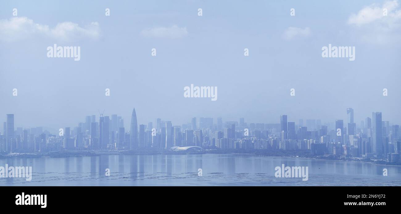 The reflections of the high-rise buildings in ShenZhen can be seen ...