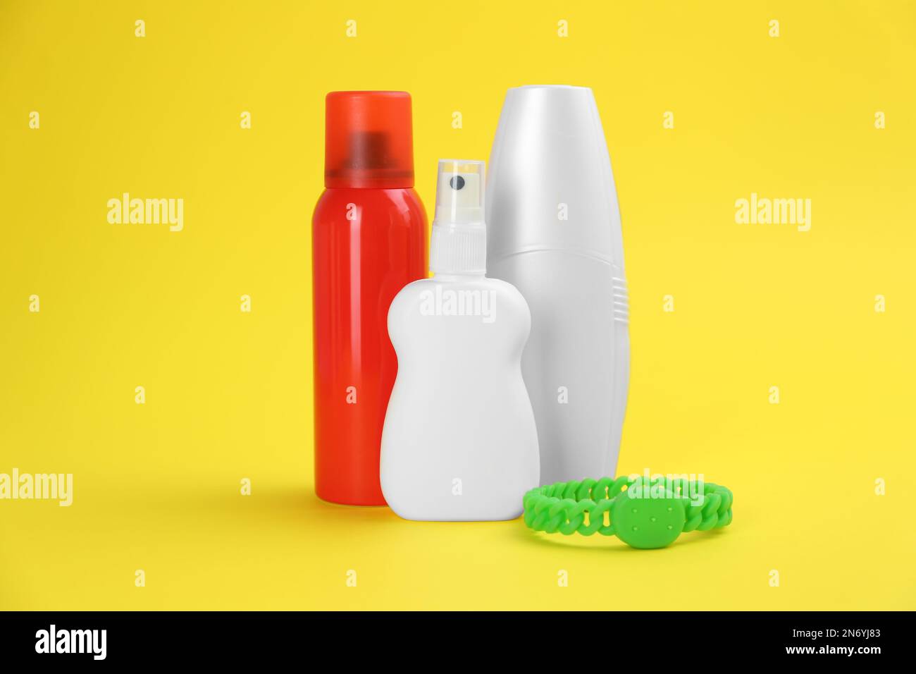 Set of different insect repellents on yellow background Stock Photo - Alamy
