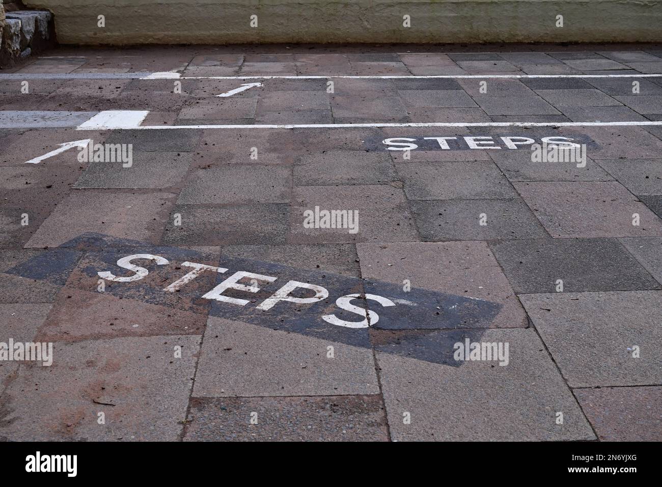 Warning signs about partly hidden steps along the seafront at Dawlish ...