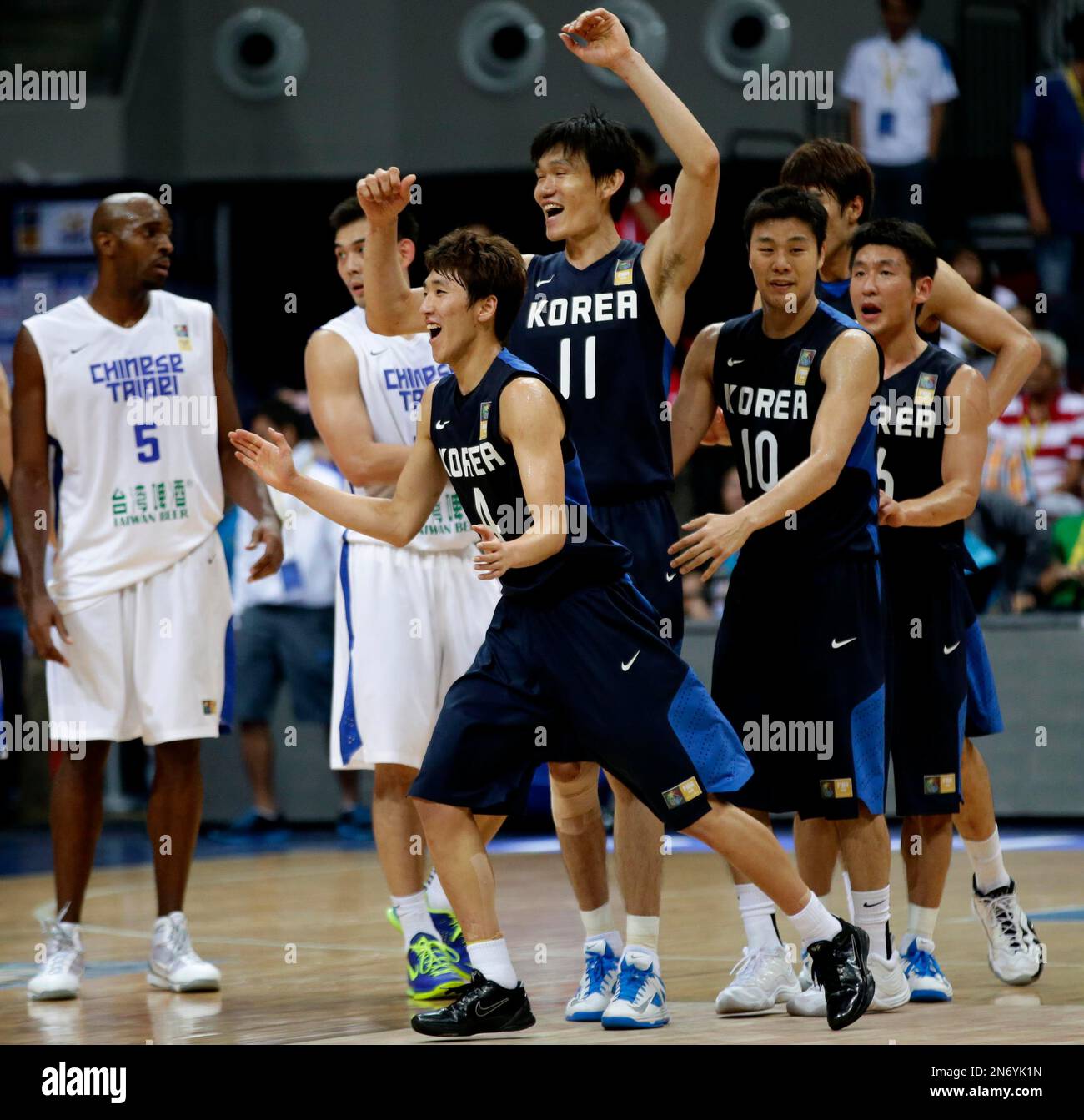 South Korean players celebrate their 75-57 victory over Taiwan in the ...