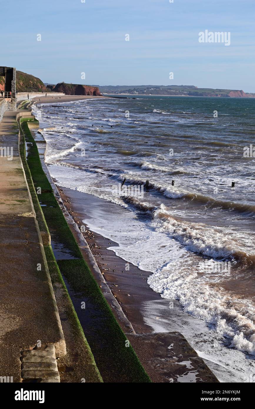 Foaming waves along the seawall at Dawlish, South Devon, looking ...