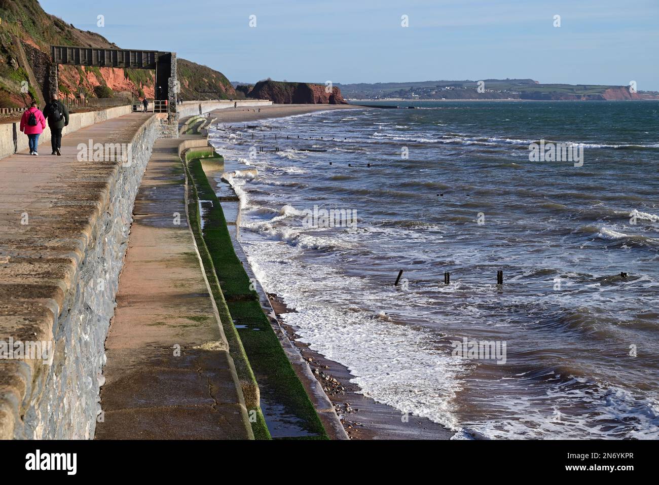 Foaming waves along the seawall at Dawlish, South Devon, looking ...