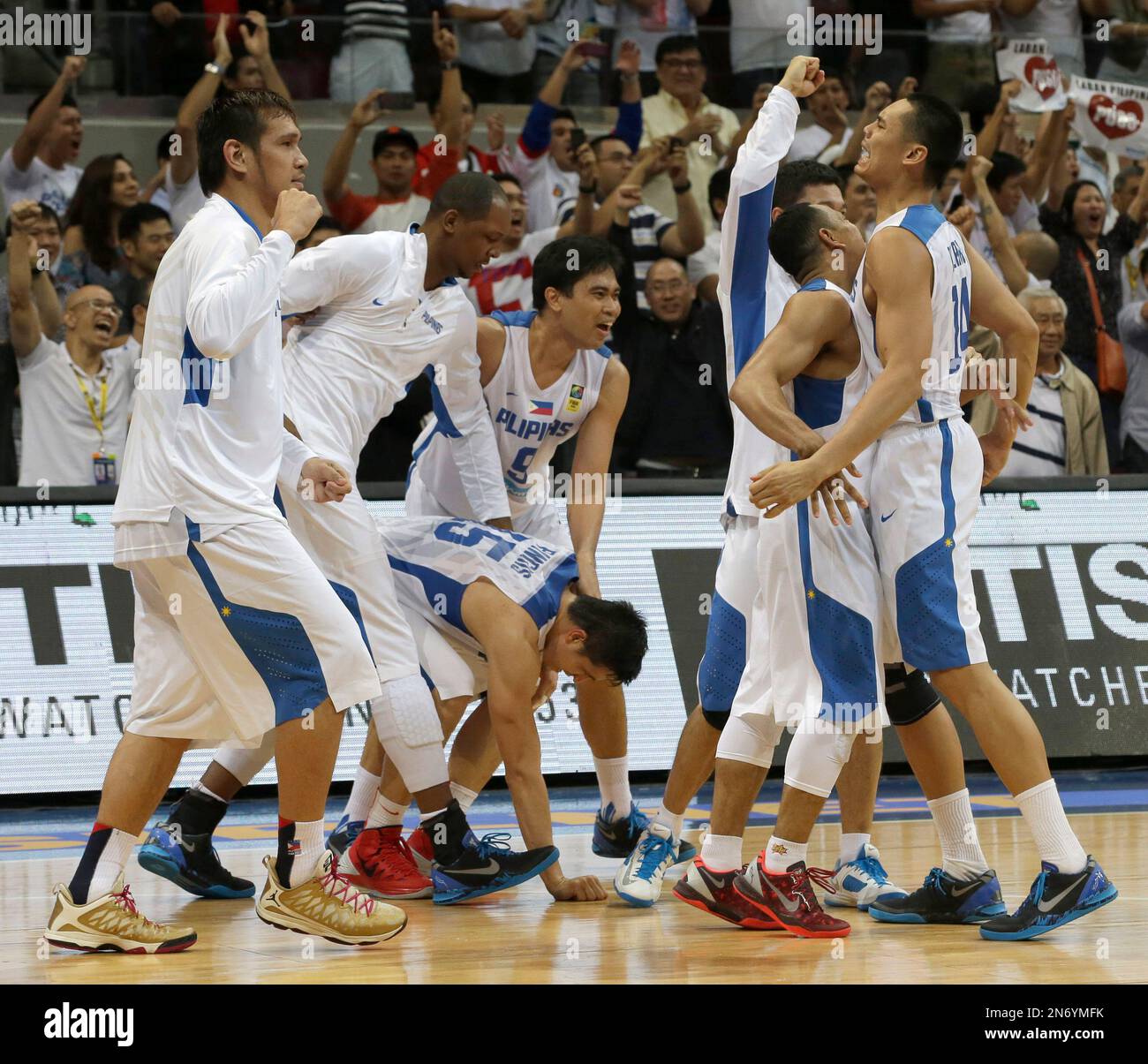 Filipino players celebrate following their 86-79 win against South ...