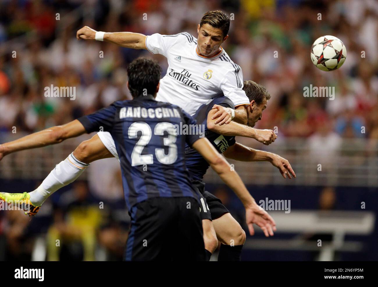 Real Madrid's Cristiano Ronaldo, top, heads the ball as Inter Milan's ...