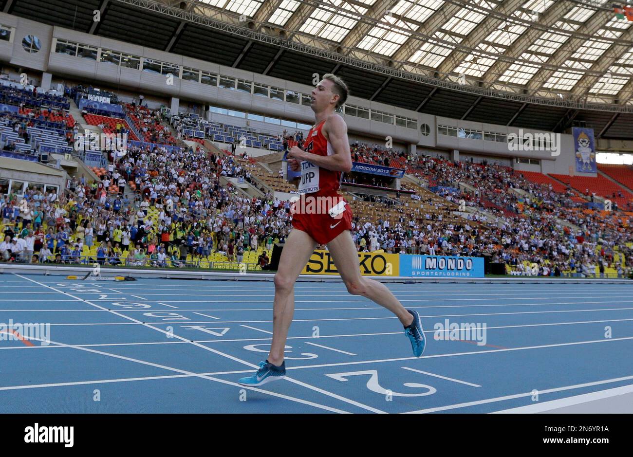 United States' Galen Rupp crosses the line to take the fourth place in ...