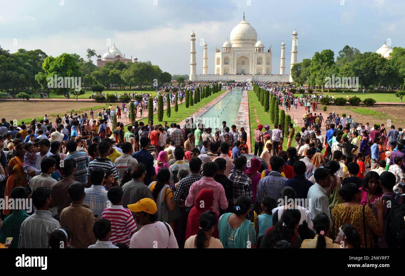 Tourists crowd the Taj Mahal in Agra, India, Saturday, Aug. 10, 2013 ...