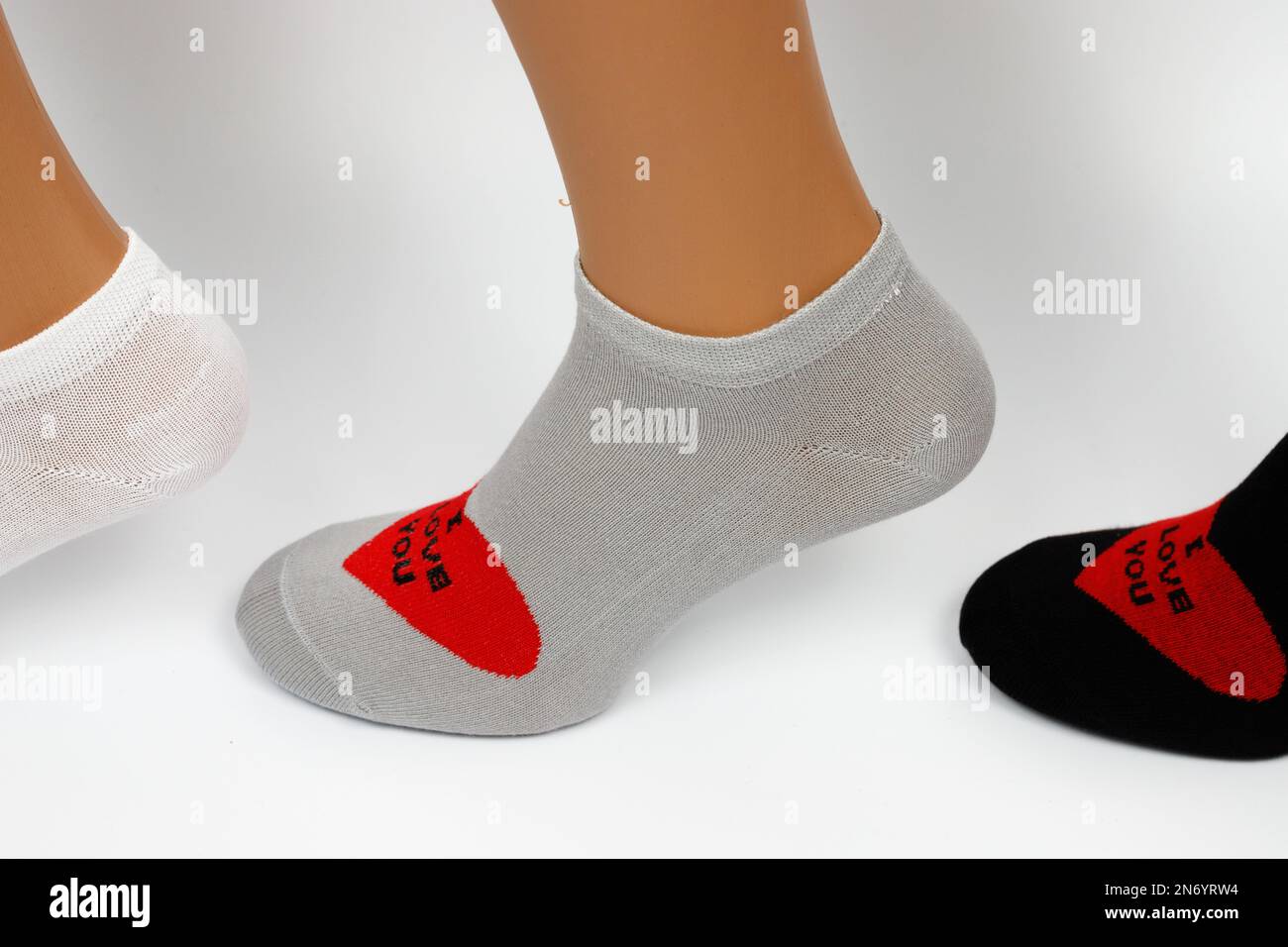Socks on a white background. Socks on the leg Stock Photo - Alamy