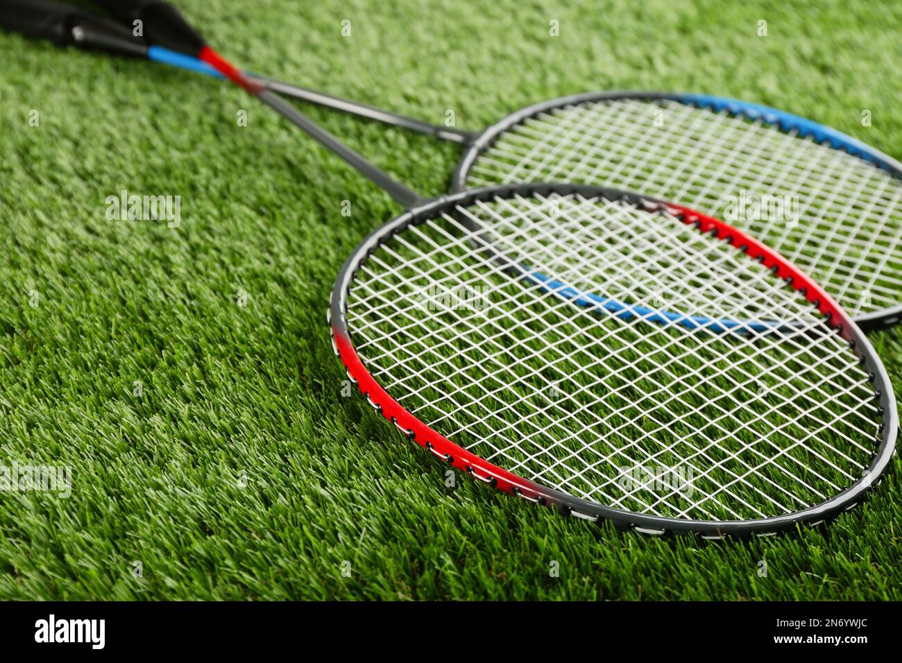 Badminton rackets on green grass outdoors, closeup Stock Photo - Alamy
