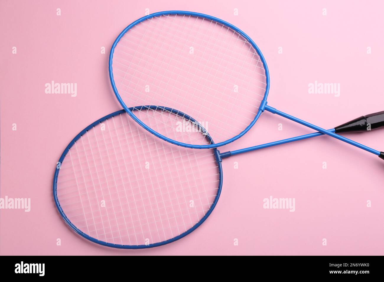 Badminton rackets on pink background, flat lay Stock Photo - Alamy