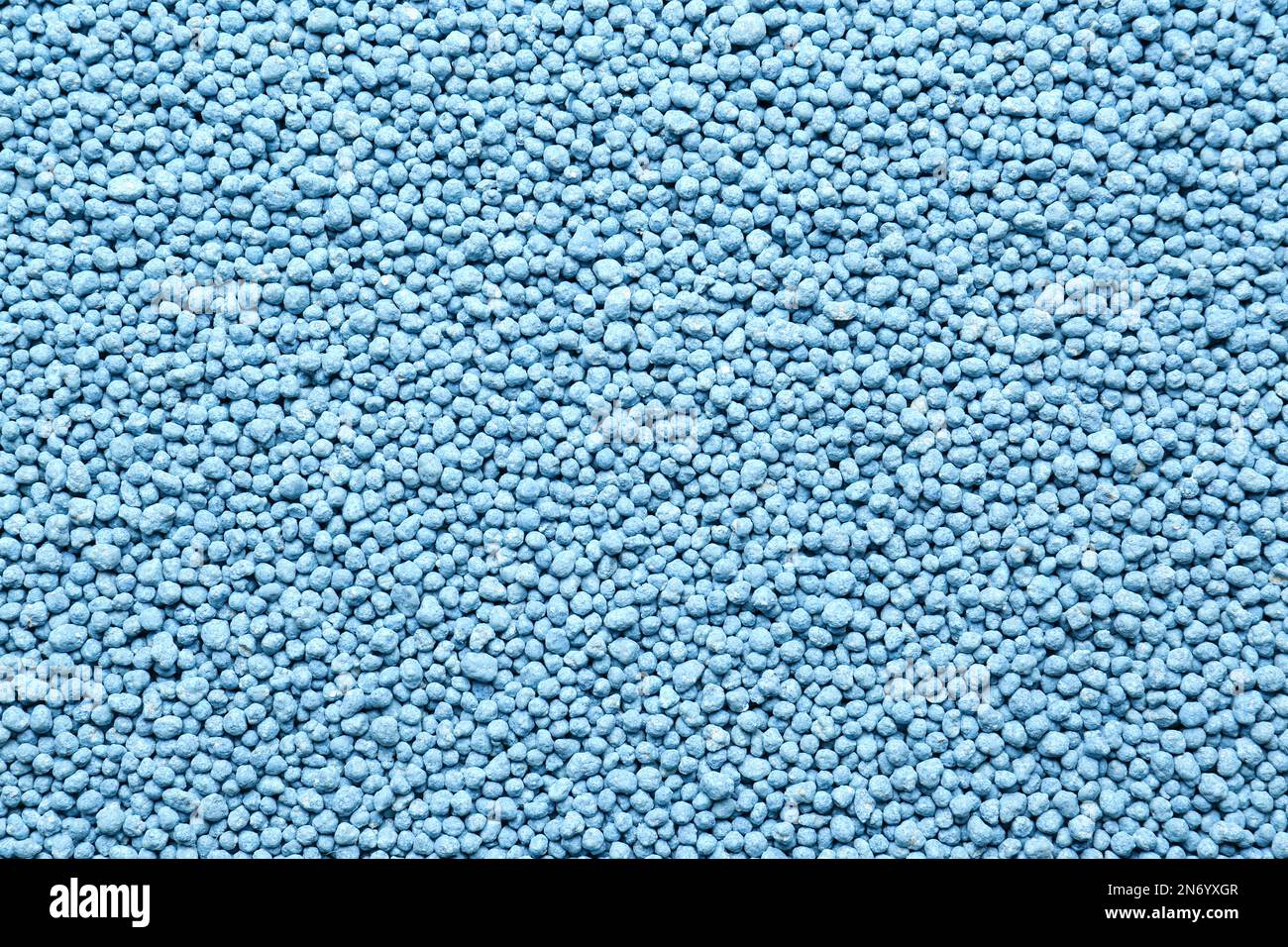 Blue granular mineral fertilizer as background, top view Stock Photo ...