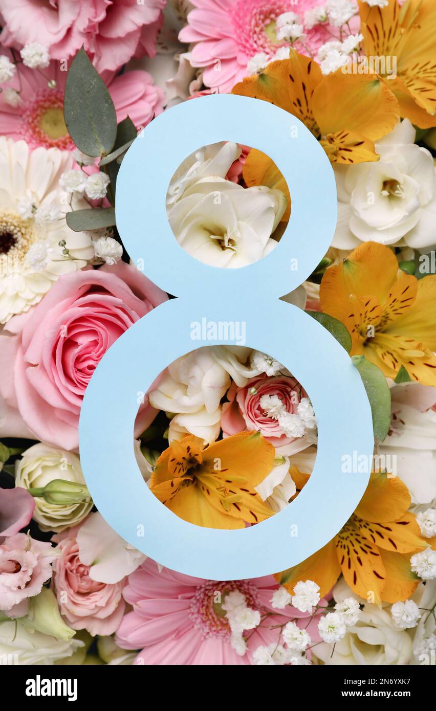Number 8 on beautiful flowers, top view. International Women's day ...