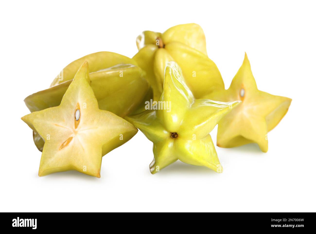 Cut and whole carambolas on white background Stock Photo - Alamy