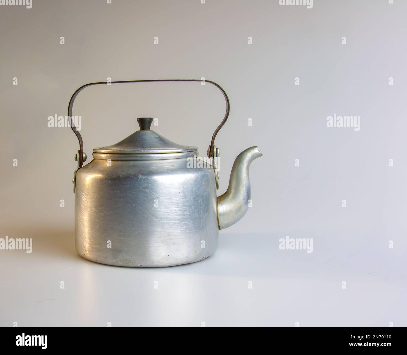 Old soldier's aluminum teapot from the Second World War on a white ...