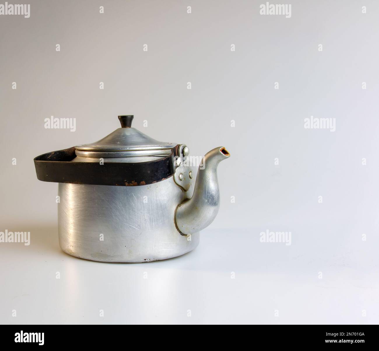 Old soldier's aluminum teapot from the Second World War on a white ...
