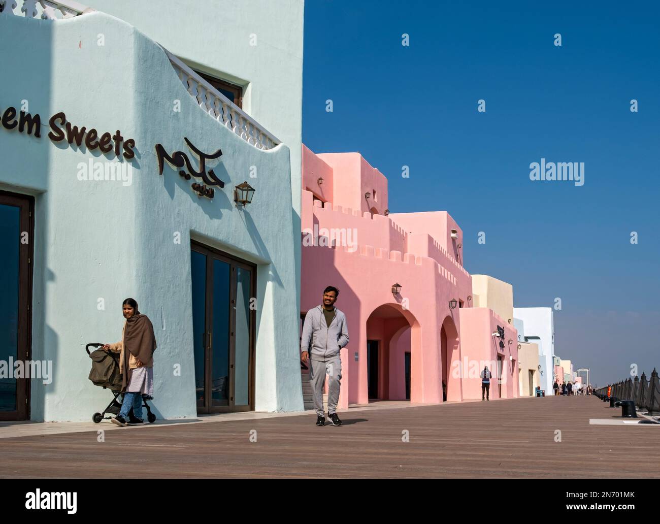 Brightly painted houses, Mina District Promenade, Old Doha Port, Qatar ...