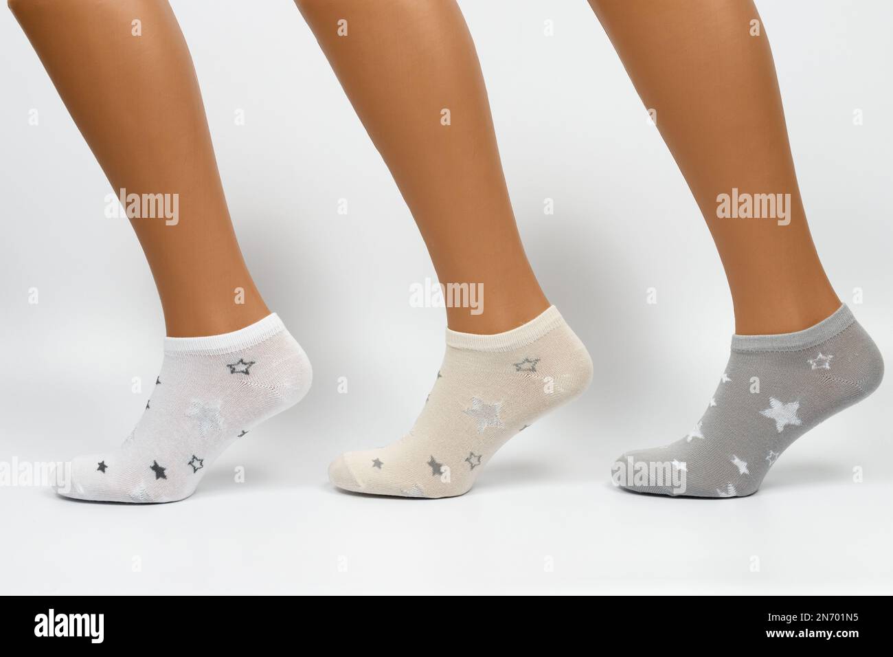 Socks on a white background. Socks on the leg Stock Photo - Alamy
