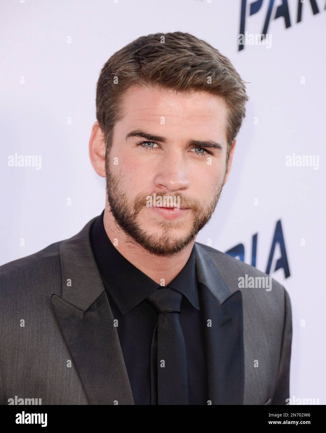 Actor Liam Hemsworth arrives on the red carpet at the US premiere of ...