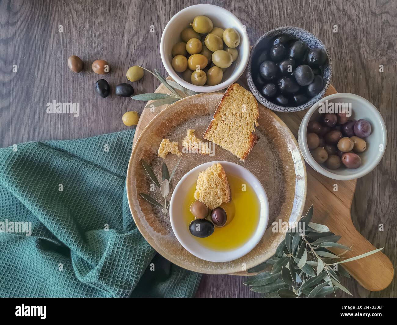 Table view consisting of several bowls with different types of olives ...