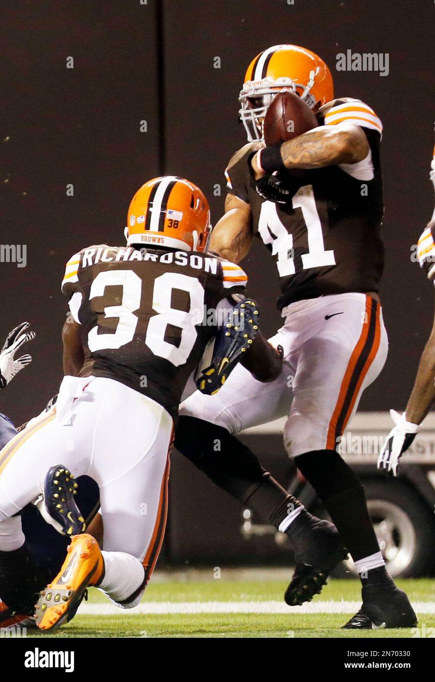 Cleveland Browns linebacker Justin Cole (41) clutches the ball for an ...