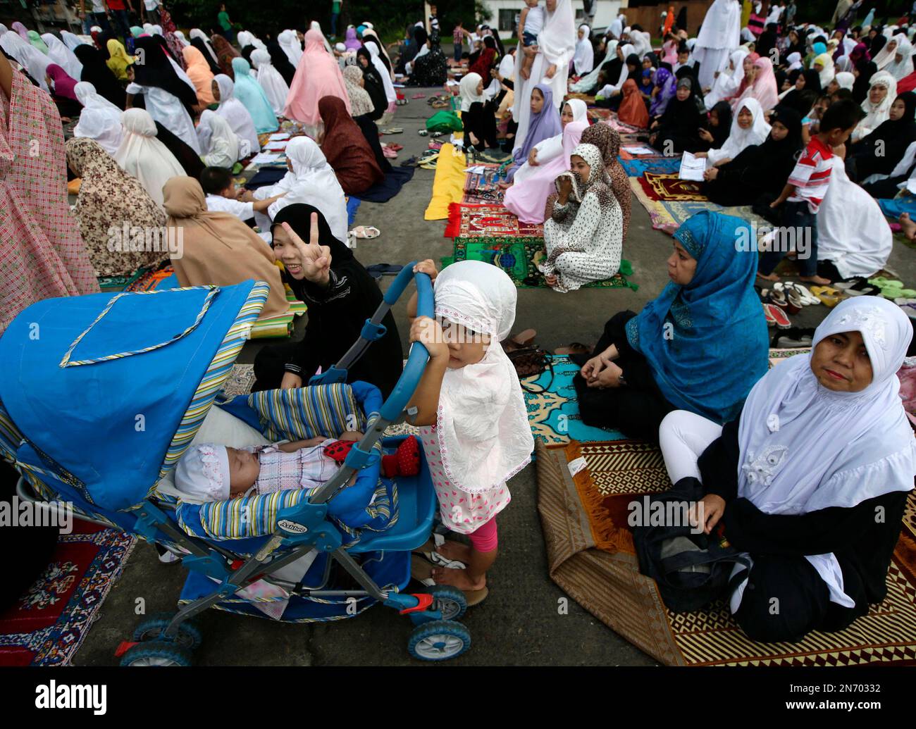 Filipino Muslims attend a prayer at the Blue Mosque to mark the ...