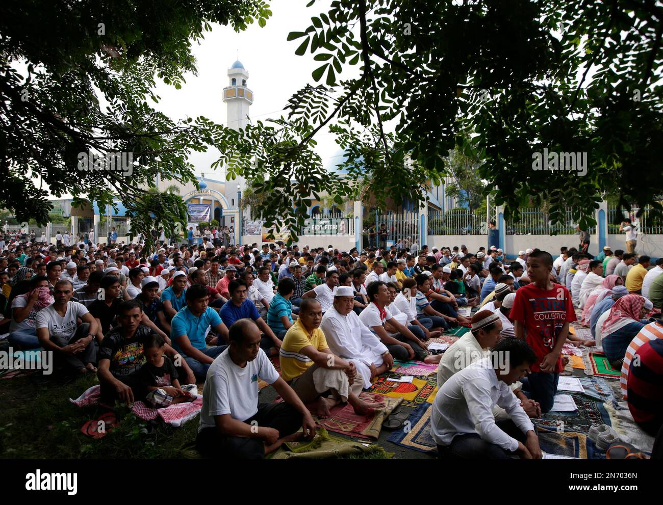 Filipino Muslims attend a prayer at the Blue Mosque to mark the ...